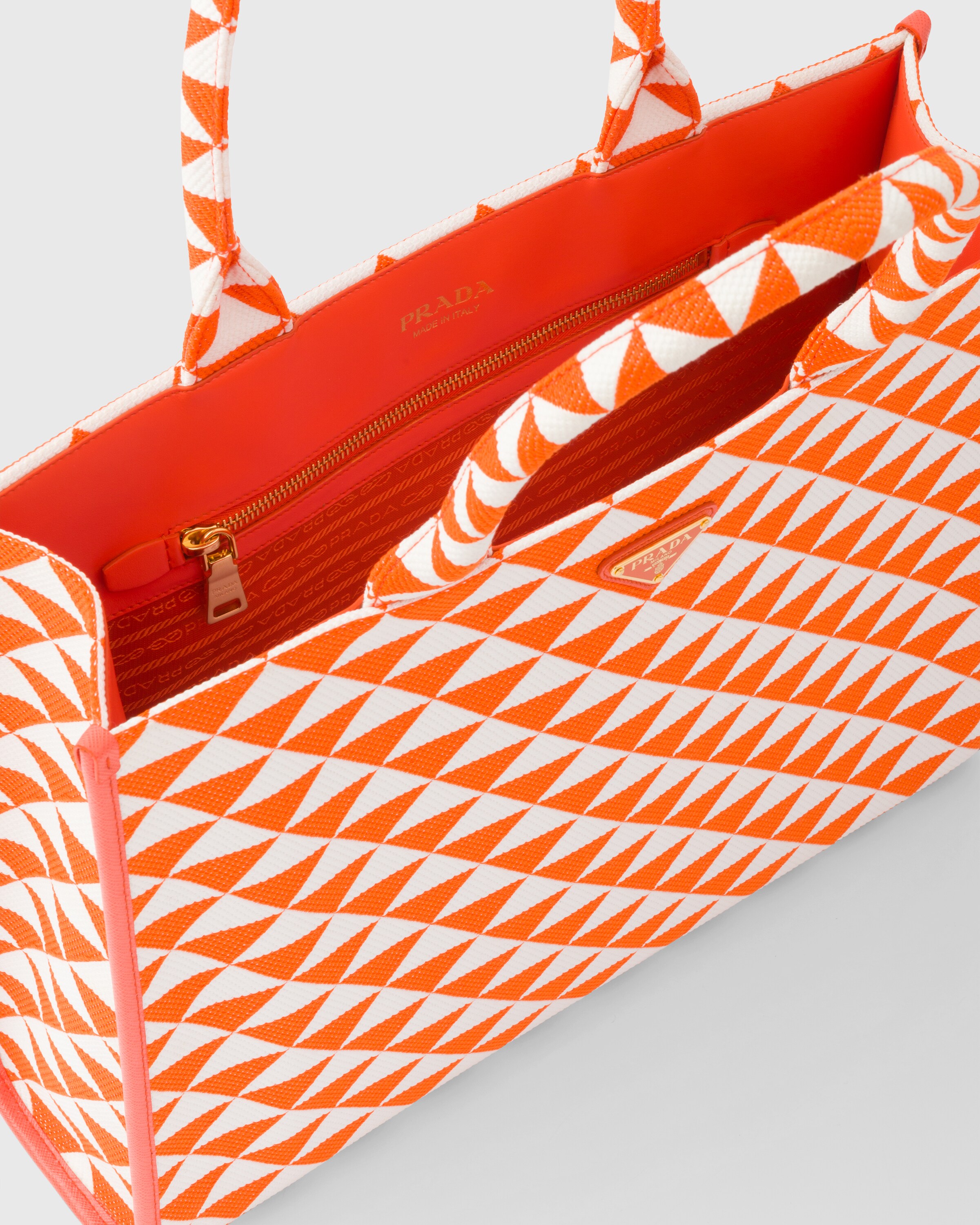 Orange/white Large Prada Symbole embroidered fabric handbag | Prada