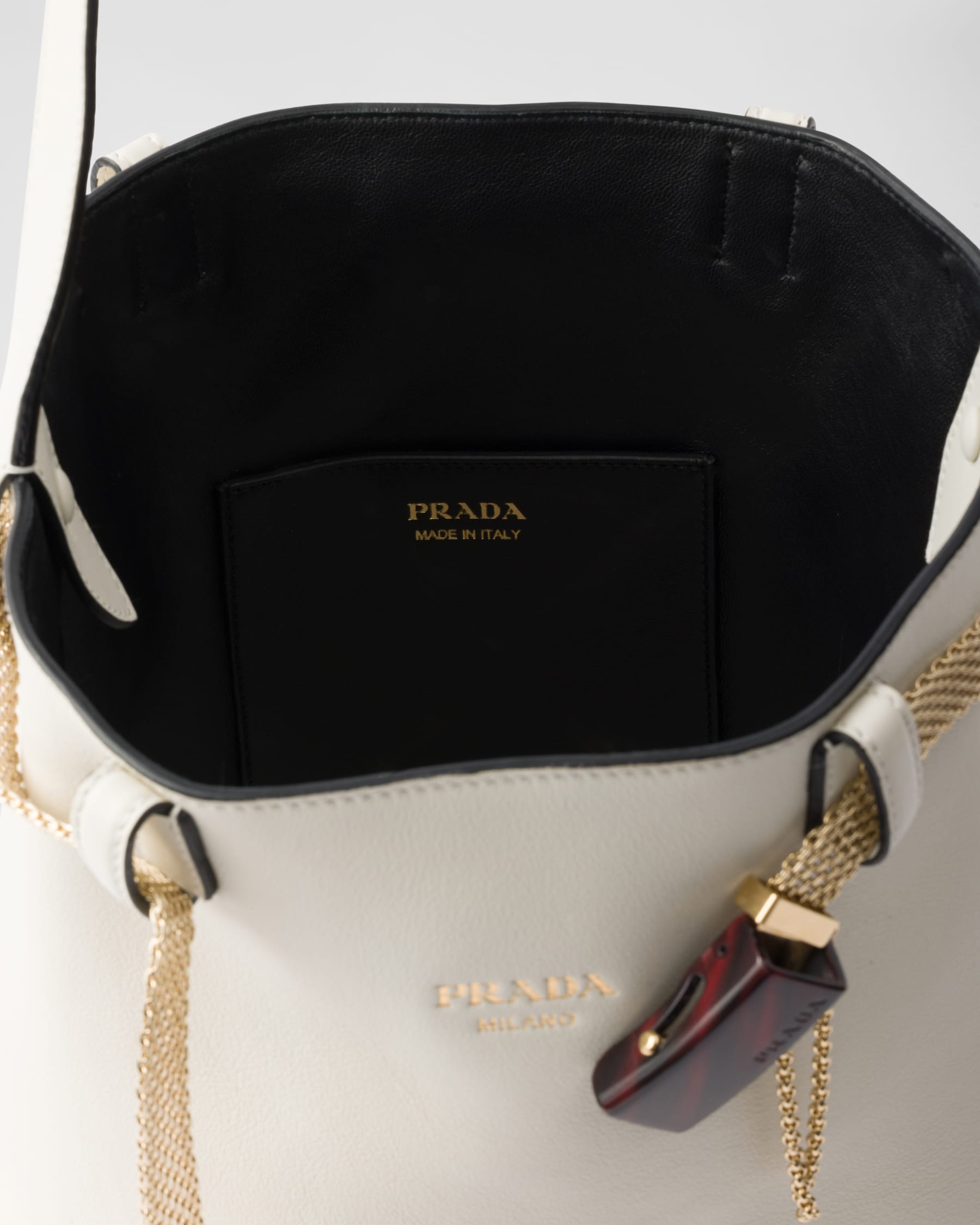 White/black Prada Buckle Leather Bucket Bag With Jeweled Belt | PRADA ...