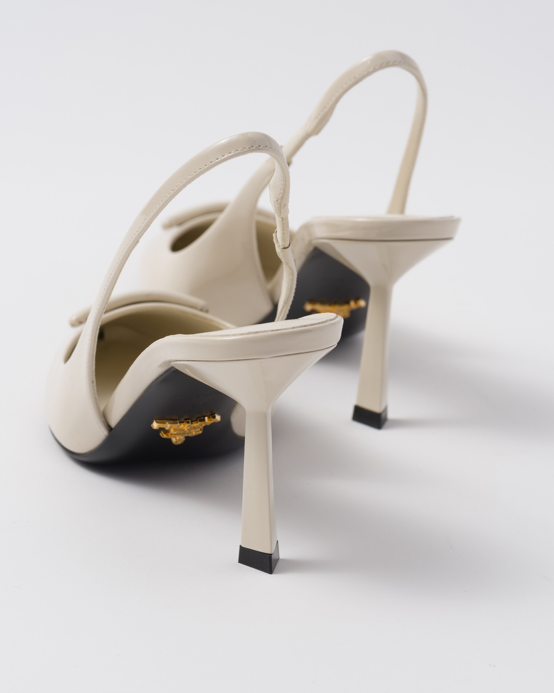 Ivory Patent Leather Slingback Pumps | PRADA