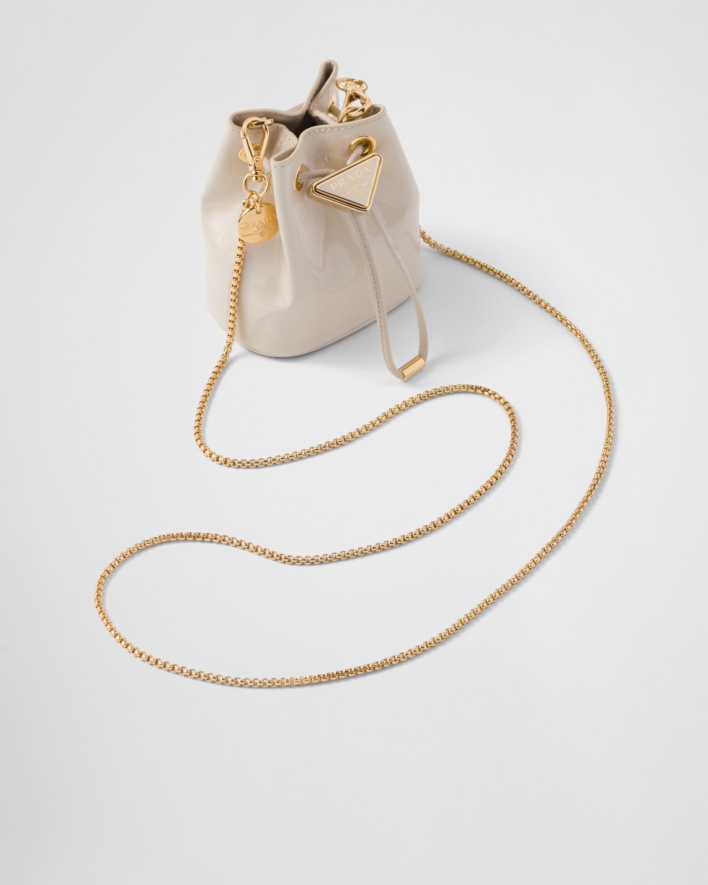 Prada Mini Logo Drawstring Shoulder Bag In Ivory | ModeSens