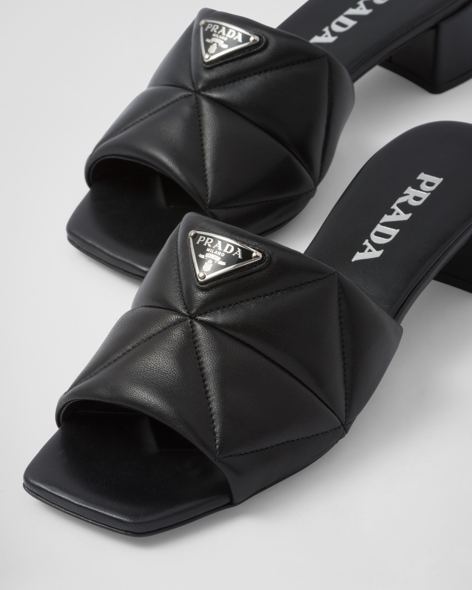 Black Quilted Nappa Leather Slides | PRADA