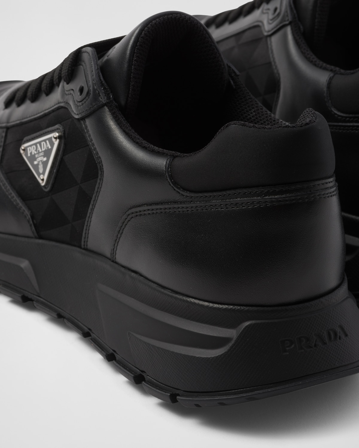 Black Leather And Re-nylon High-top Sneakers | PRADA