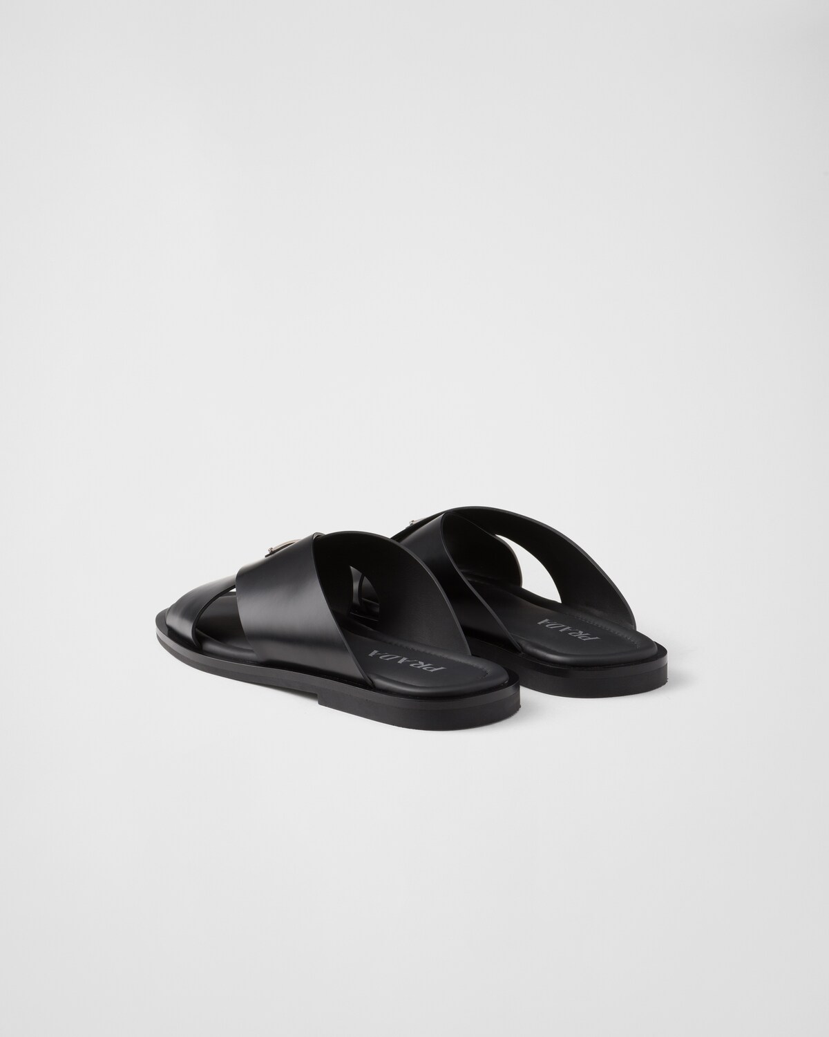 Black Brushed Leather Crisscross Slides | PRADA