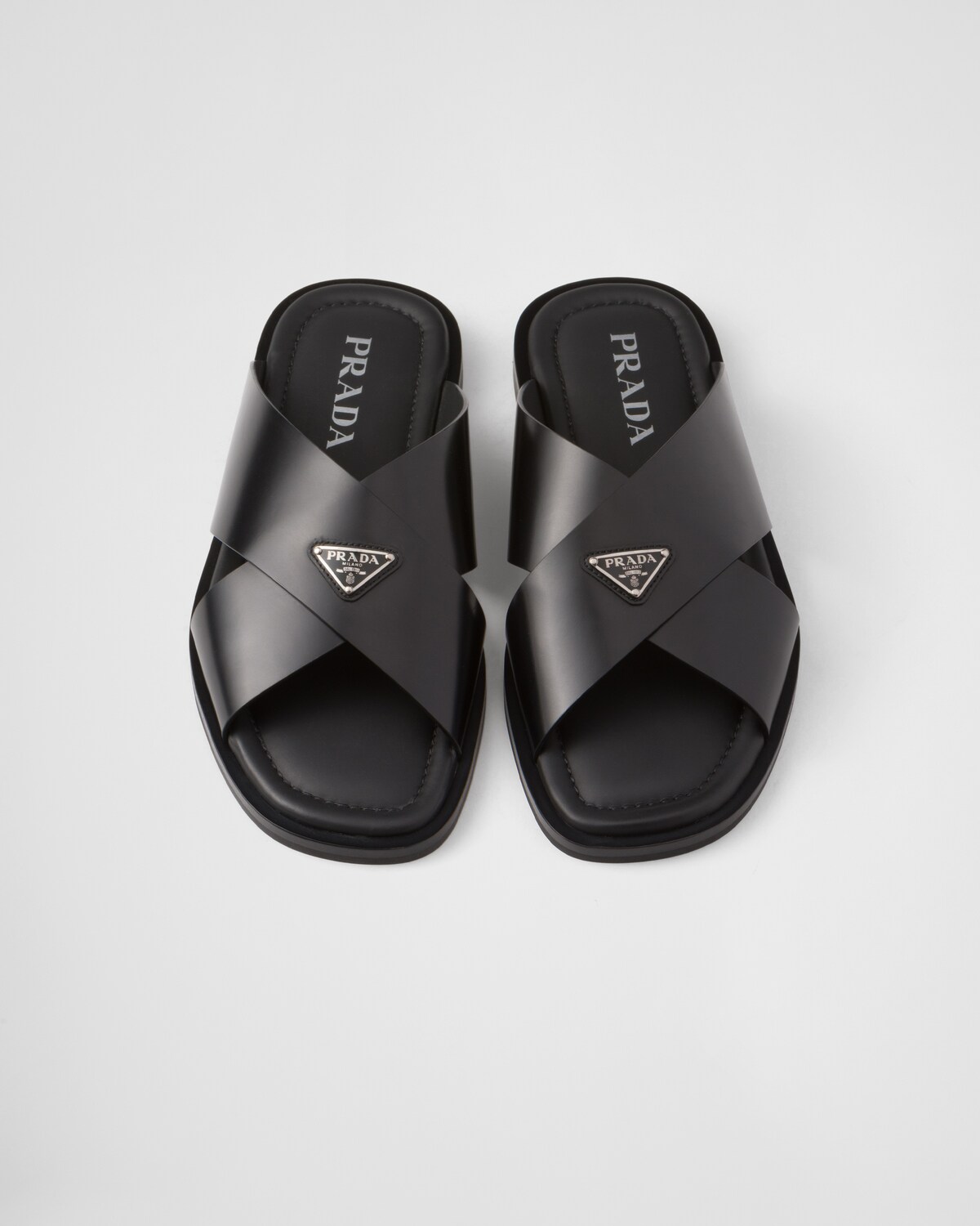 Black Brushed Leather Crisscross Slides | PRADA
