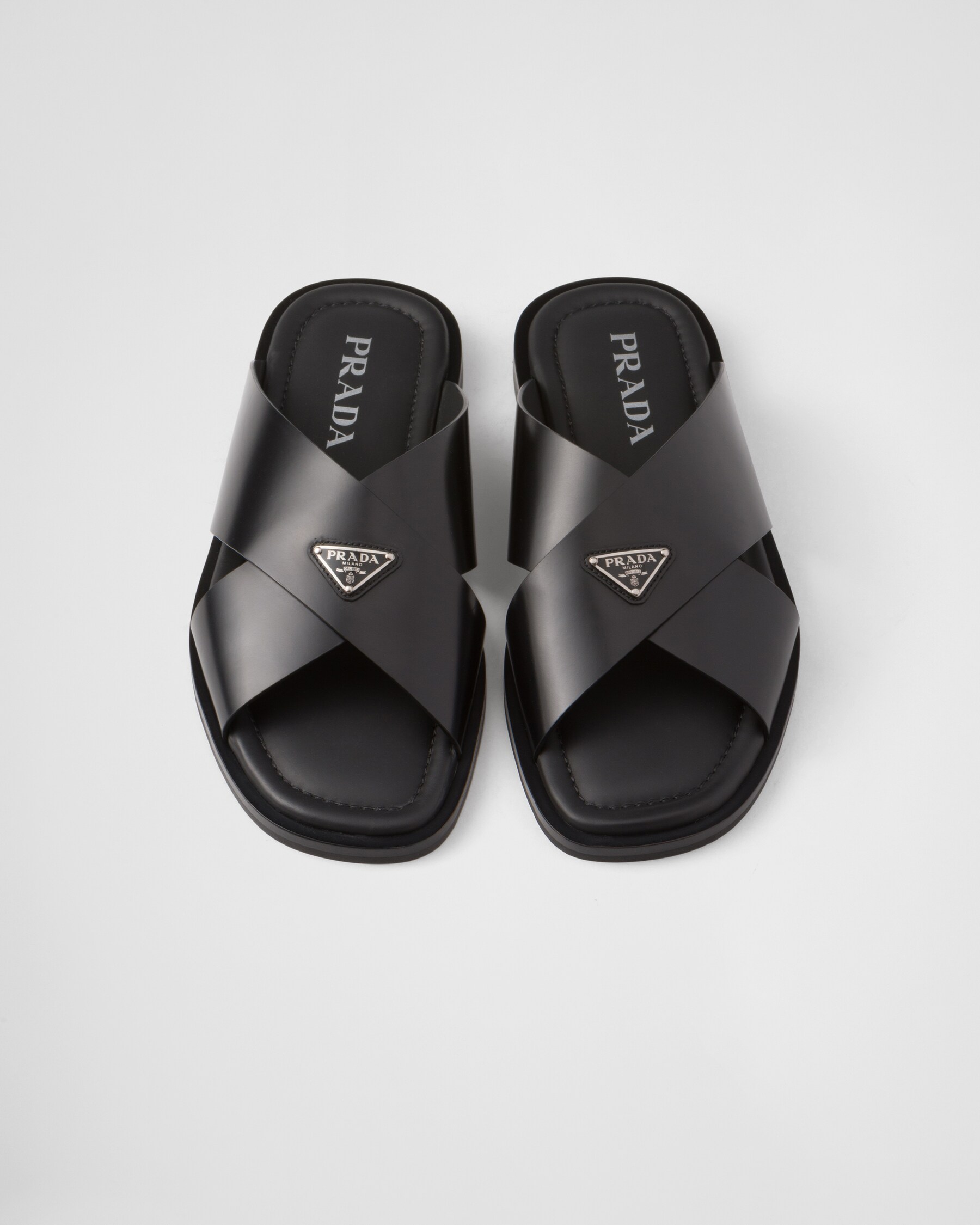 Black Brushed Leather Crisscross Slides | PRADA