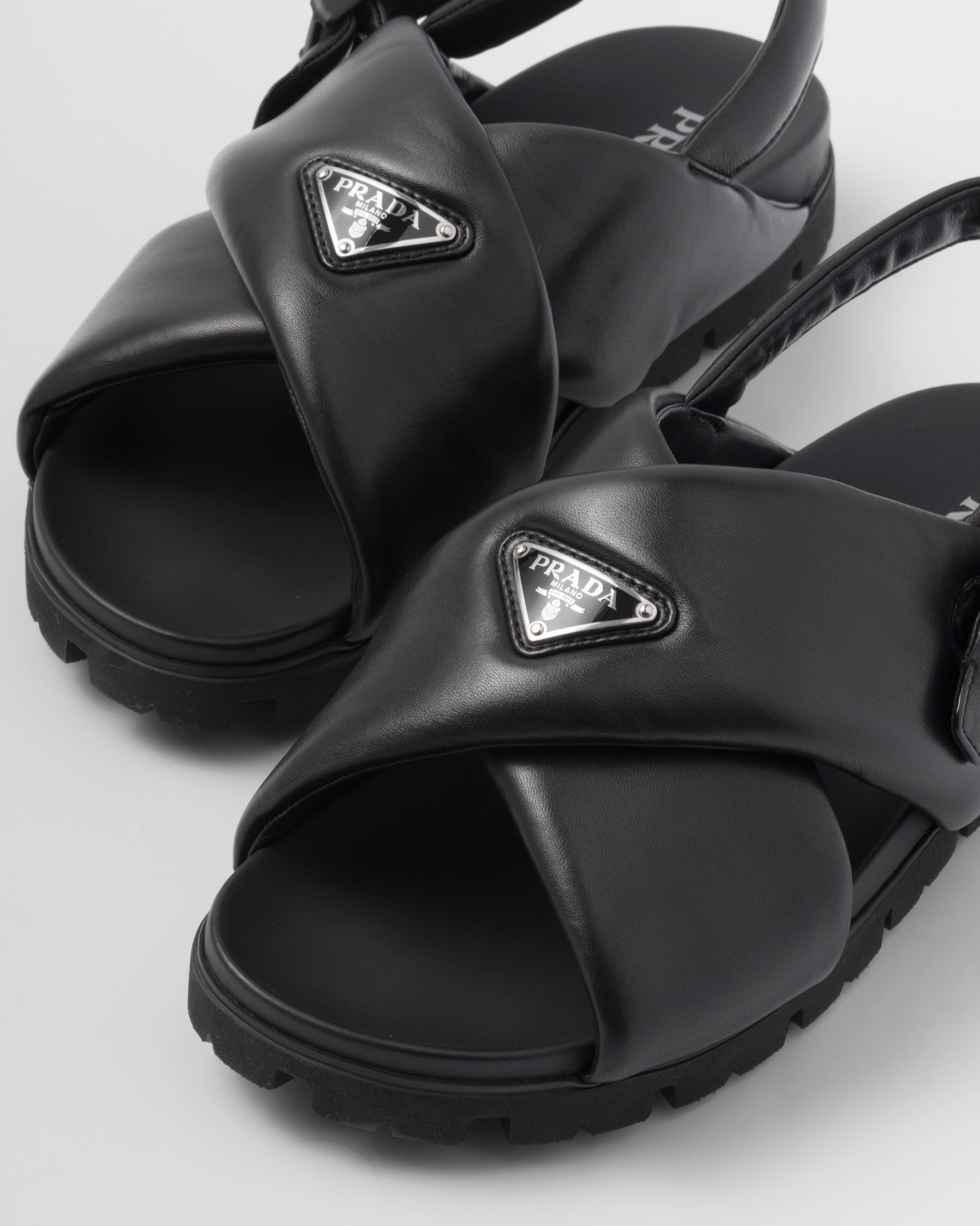 Black Padded nappa leather crisscross sandals | Prada