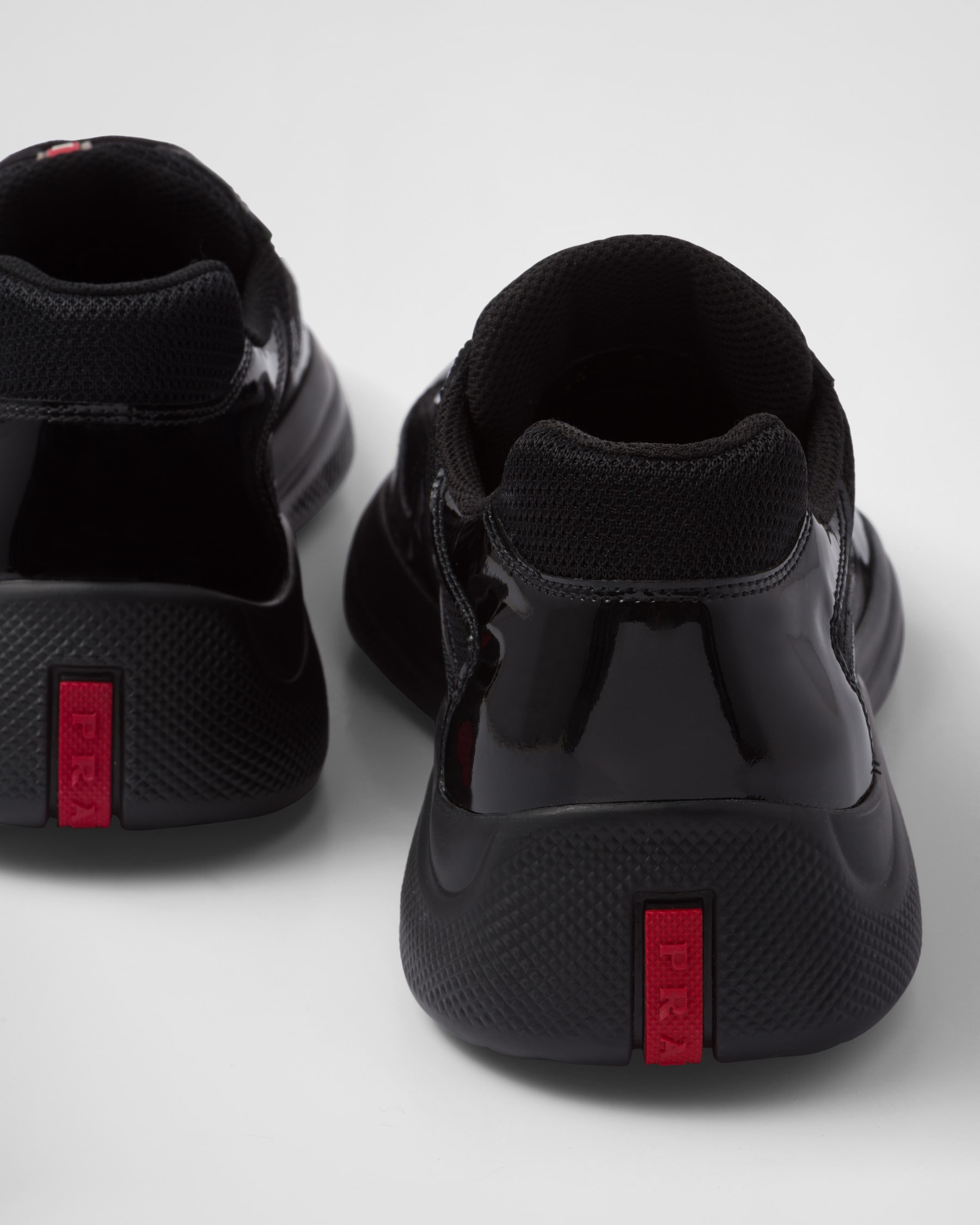 Sneakers Prada America’s Cup En Cuir Verni Et Tissu Technique Noir | PRADA