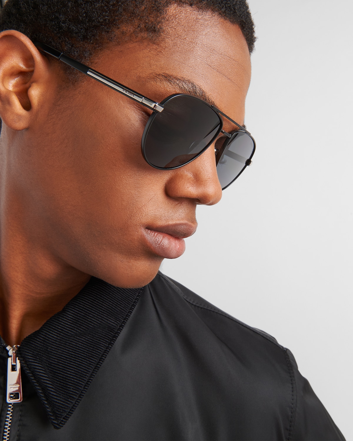 Polarized Black Lenses Sunglasses With Iconic Metal Plaque Prada