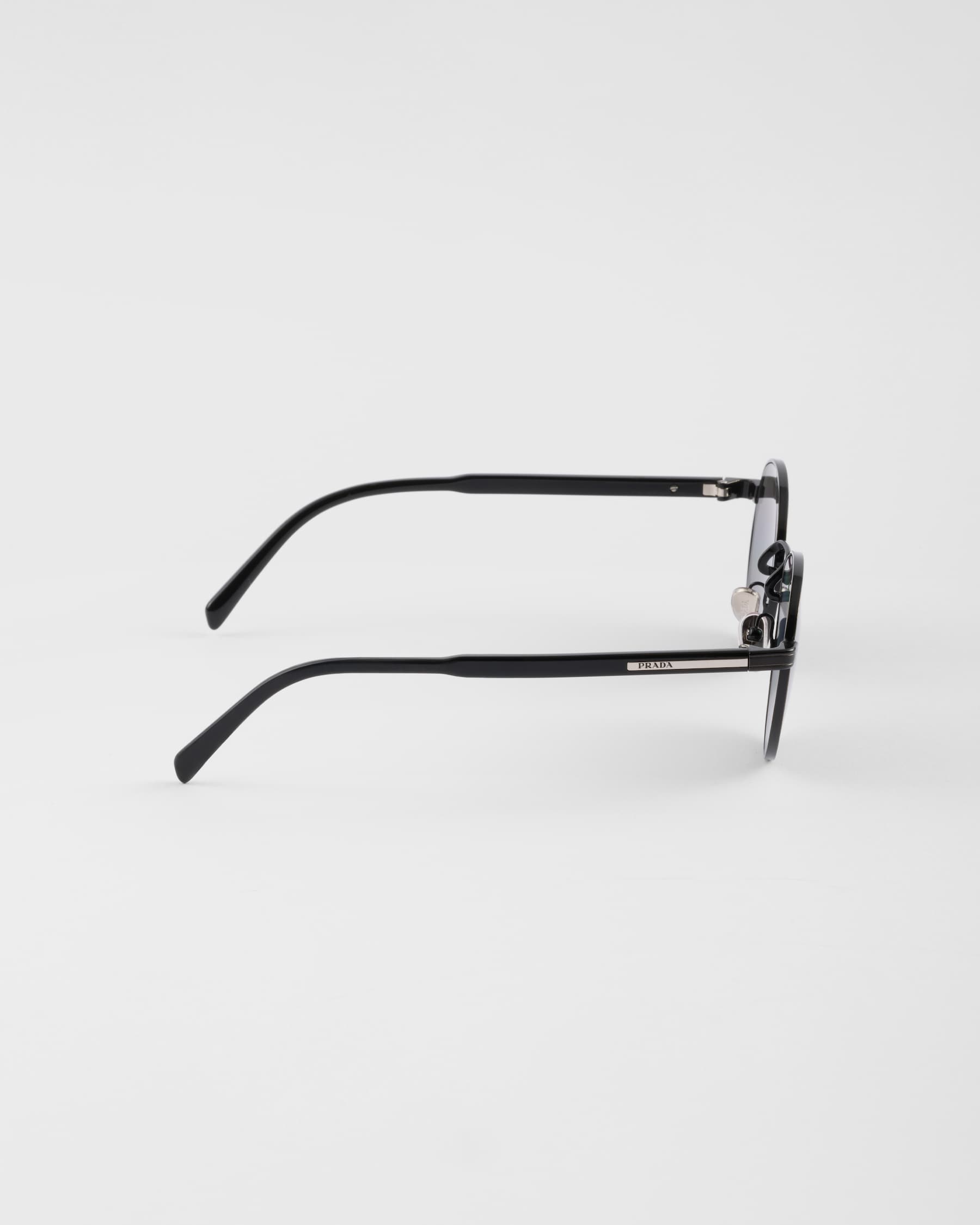 Polarized Black Lenses Sunglasses With The Iconic Metal Plaque | PRADA
